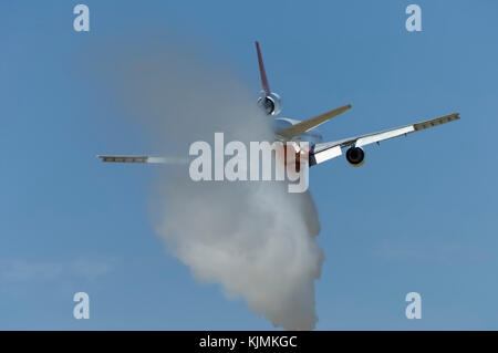 tanker dropping water from an external mounted under fuselage 12,000 US ...