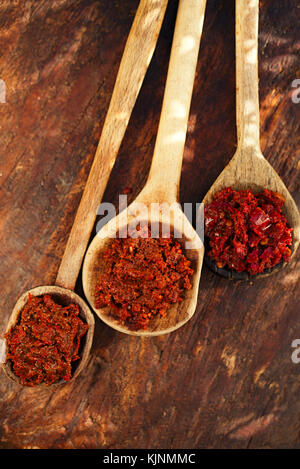 Traditional georgian sauce spicy ajika on rustic background with copy ...
