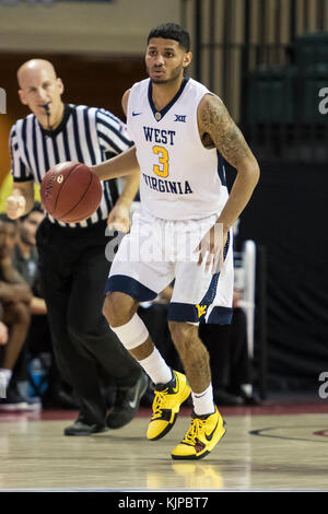 West Virginia guard James Bolden (3) drives past Kansas guard Devon ...