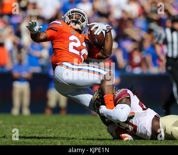 Florida State running back Trey Benson (3) is tackled by LSU safety ...