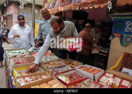 Cairo, Egypt. 22nd Nov, 2017. A vendor prepares special candies and ...
