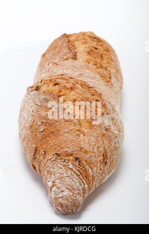 Large loaf of traditionally baked bread isolated on white Stock Photo ...