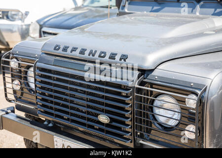 Front view of a grey Land Rover Defender 110 off-road 4x4. Features a ...