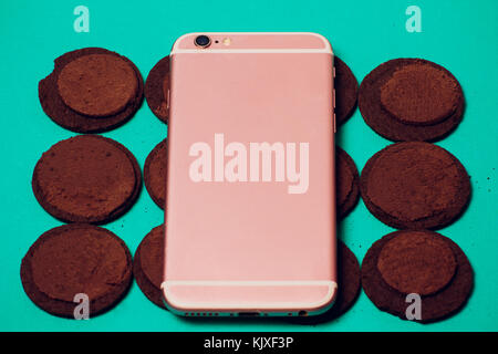 Modern mobile smartphone chocolate cookies stacked served milk the ...