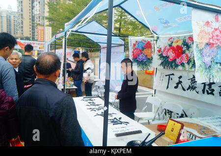 A Chinese calligraphy artist is selling his own calligraphy paintings ...