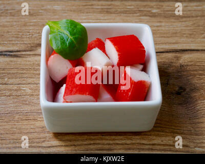 Surimi in a recipe on wood background Stock Photo - Alamy