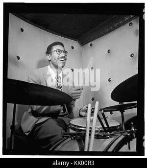 A portrait of jazz drummer Max Roach performing at the Three Deuces ...