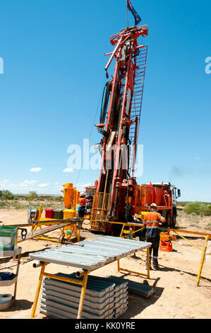 Exploration core drilling with RC drill rig fitted with dust ...