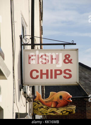 A sign advertising a traditional fish and chip shop in the coastal town ...