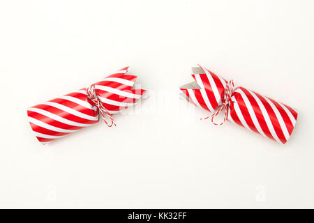 Pulled christmas cracker on a white background crackers Stock Photo - Alamy