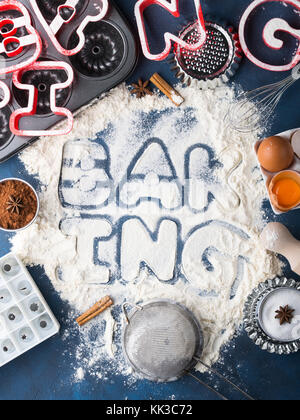 Flour letters spelling Baking with tools and sweet food ingredients ...