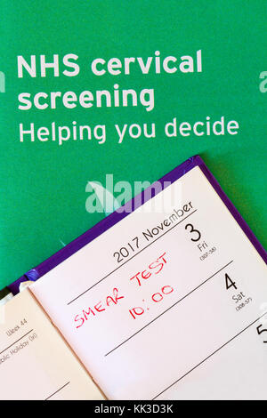 NHS cervical screening leaflet close up with miniature female figurines ...