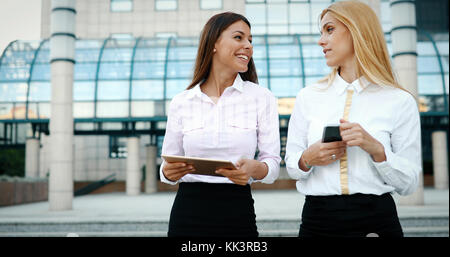 Picture of young attractive business partners standing Stock Photo - Alamy
