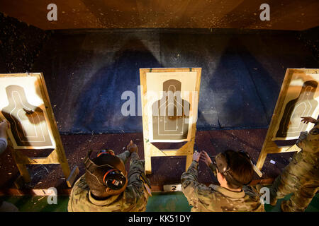 An alternate M9 pistol qualification course scorecard, magazines, an M9 ...