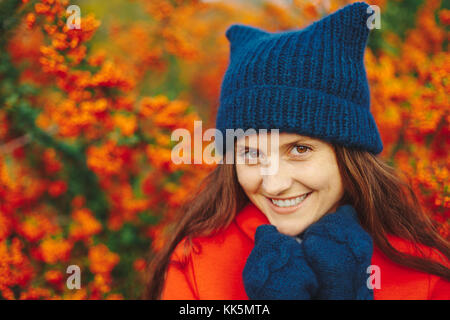 Model wearing stylish winter beanie hat and gloves smiling Stock Photo ...