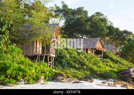 Bamboo huts on tropical island Stock Photo - Alamy