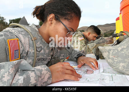 Spc. Emefa Freckleton uses a protractor and map to plot five ...
