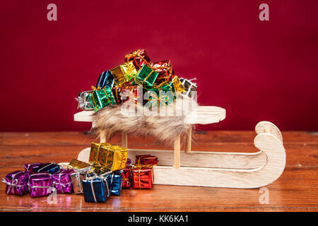 little lovely presents on a sleigh, top view Stock Photo - Alamy