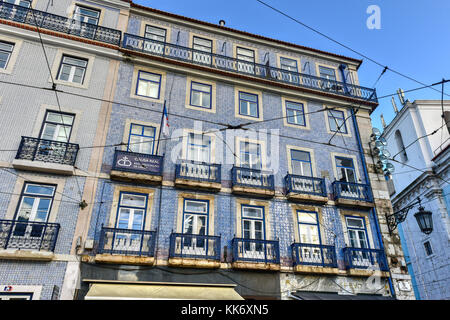 Lisbon windows with typical portuguese tiles on the wall. Selective ...
