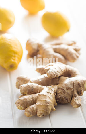 Fresh raw ginger and lemon on white background Stock Photo - Alamy
