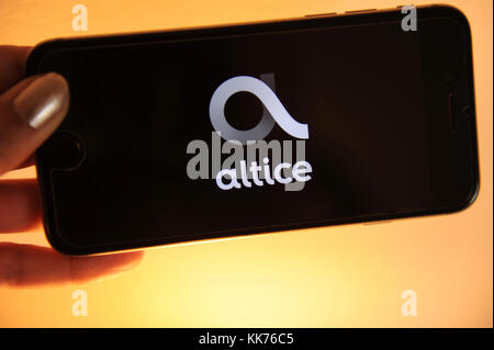 In this photo illustration, the Altice logo is displayed on the screen ...