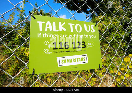 A Samaritans sign with a suicide helpline phone number on the edge of ...