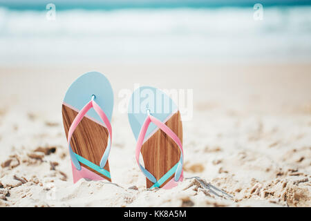Trendy slippers on white sandy ocean beach Stock Photo - Alamy