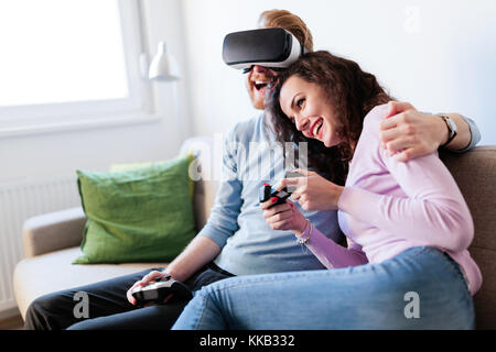 Young family playing games with virtual reality glasses Stock Photo - Alamy