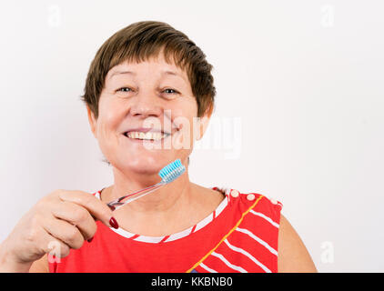 grandma brushing her teeth with a brush Stock Photo - Alamy