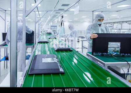 Conveyor for the production of television sets. Testing TVs in the ...