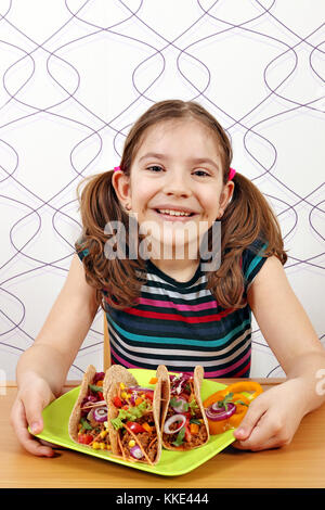 Mexican girl with tacos Stock Photo - Alamy