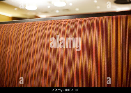 orange fabric sofa couch furniture in living room near wood wall Stock ...