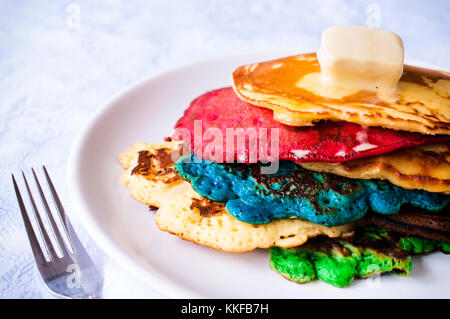 Colorfull homemade pancakes with melted butter on the top Stock Photo ...