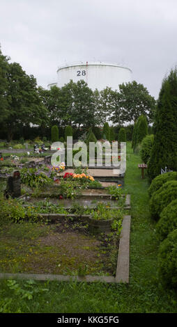 Graveyard near oil tanks, in the former closed town of Paldiski ...