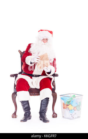 Bad Santa reading letters Stock Photo - Alamy