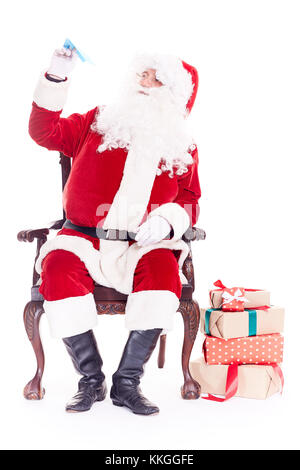 Santa launching paper airplane Stock Photo - Alamy
