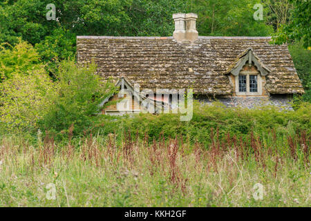 Derelict cottage in the wood and overgrown garden Stock Photo - Alamy