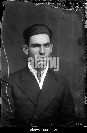This image features a man dressed in formal attire, embodying the ...