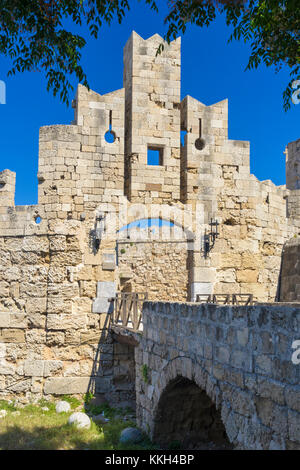 Entrance gate to the medieval city of Rhodes and a stone bridge leading ...