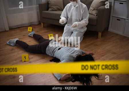 Criminalist collecting evidence at crime scene,forensic science Stock Photo - Alamy