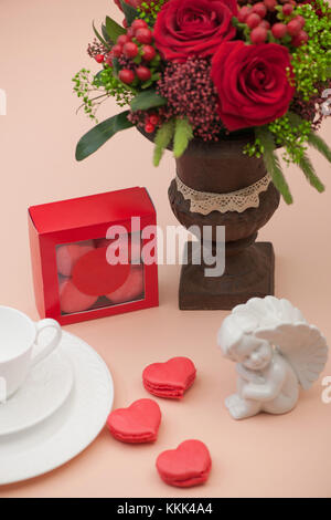 Gift box with flowers and cookies on dark background Stock Photo - Alamy
