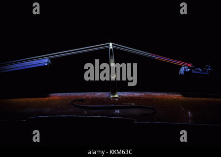 Closeup view of an old dusty cello, accentuated shapes with light Stock ...