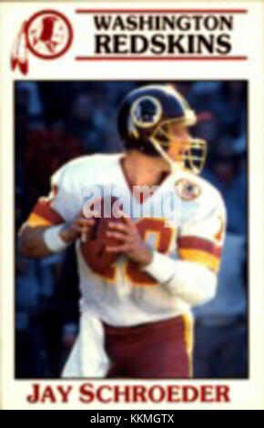 Washington Redskins quarterback Jay Schroeder (10) is grabbed by New ...
