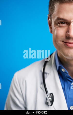 Vertical portrait of confident male doctor wearing white medical ...