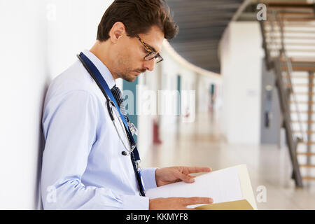 Young doctor man wearing stethoscope over isolated background In shock ...