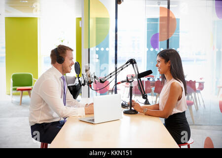 Radio podcast, laptop or black man with microphone interview ...