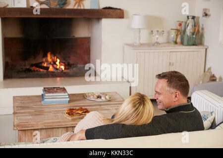 Two women sitting by an open fire in the Bushmills Inn, Bushmills ...