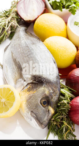 photo of bream with different ingredients on white background Stock ...