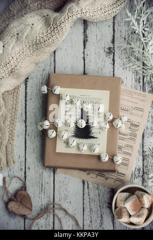 Top view on Christmas gift wrapped in craft gift paper decorated with ...