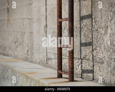 Rusty steel wall ladder Stock Photo - Alamy